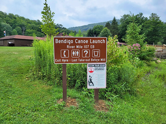 The canoe launch sign marks your entry point to aquatic adventure. Like life's best journeys, this river doesn't come with spoiler alerts.