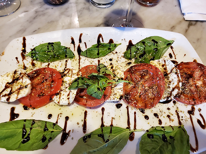 The Caprese salad&mdash;Italy's edible flag. Fresh mozzarella, vibrant tomatoes, and basil drizzled with balsamic tell a simple, perfect story.