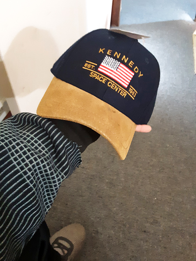 One shopper's Kennedy Space Center souvenir becomes another's vintage-cool statement piece. That's thrift store alchemy at work!