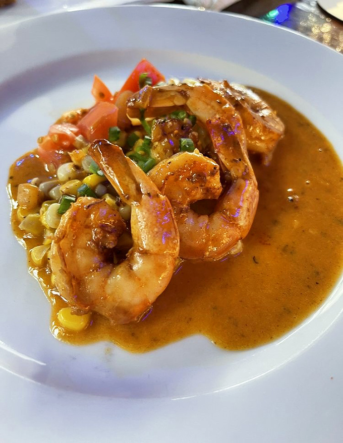 Caribbean BBQ shrimp swimming in a sauce so good you'll be plotting ways to smuggle it home in your carry-on.