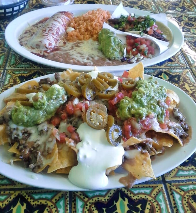 A fiesta on two plates! The combination platter brings friends together&mdash;rice, beans, and guacamole forming a delicious committee while nachos hold their own meeting below.