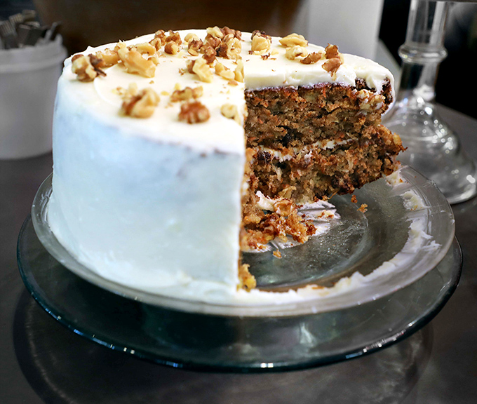 Not just dessert but an engineering marvel&mdash;layers of spiced perfection supporting a cream cheese frosting that defies gravity. Photo credit: <a href="https://www.google.com/maps/contrib/110287897304151998022/photos/@28.3640538,-82.1892192,3a,75y,90t/data=!3m7!1e2!3m5!1sAF1QipPUjIU55mAB8so92QPGKKW0Mae6ZN-FIGQvomf0!2e10!6shttps:%2F%2Flh3.googleusercontent.com%2Fp%2FAF1QipPUjIU55mAB8so92QPGKKW0Mae6ZN-FIGQvomf0%3Dw401-h260-k-no!7i1632!8i1056!4m3!8m2!3m1!1e1?entry=ttu&g_ep=EgoyMDI1MDgxMy4wIKXMDSoASAFQAw%3D%3D" target="_blank" rel="noopener noreferrer">Florida Cracker Lunch On Limoges</a>	Not just dessert but an engineering marvel&mdash;layers of spiced perfection supporting a cream cheese frosting that defies gravity.