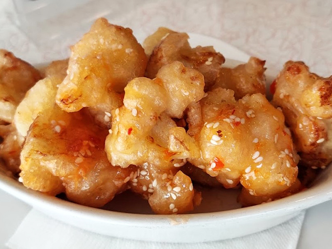 Golden cauliflower bites glistening with sweet-spicy sauce&mdash;proof that vegetables can party just as hard as their meaty counterparts.