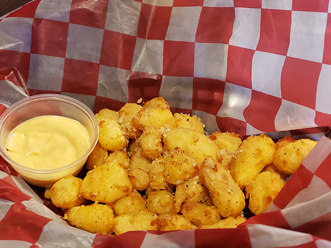 Wisconsin's unofficial state treasure: cheese curds. Golden, crispy exterior giving way to that signature squeaky, melty goodness that dreams are made of.