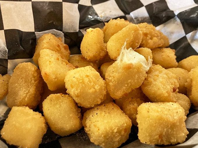 Wisconsin cheese curds: where dairy becomes divine. These golden nuggets of joy deliver that signature squeak between your teeth that separates the authentic from the imitators.
