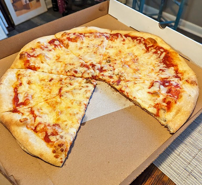 The classic cheese pizza &ndash; proof that simplicity, when executed perfectly, needs no embellishment. The holy trinity of dough, sauce, and cheese.