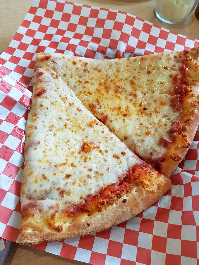 The cheese pizza that reminds you why classics become classics. That golden-brown crust is the supporting actor that steals the show.