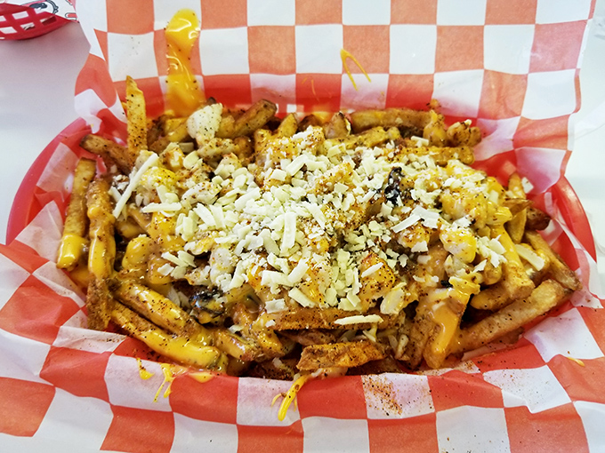 These cheese-smothered fries arrive looking like they've been blessed by the dairy gods of Wisconsin.