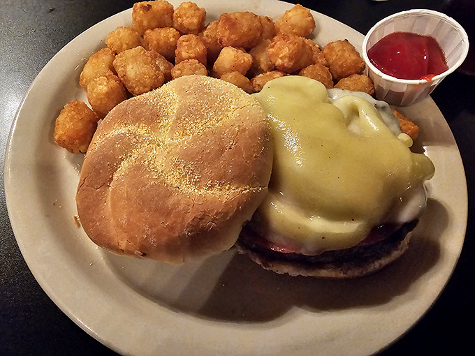 This isn't just a cheeseburger; it's comfort on a bun with tater tots playing the delicious supporting role they were born for.