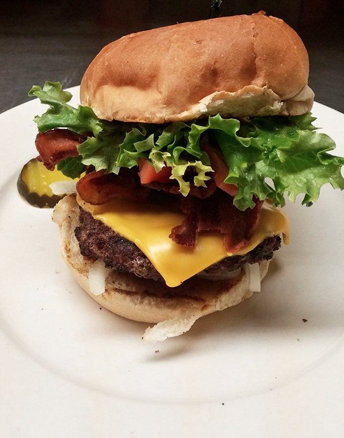 This isn't just a burger; it's architectural perfection. The cheese-to-bacon-to-beef ratio would make Frank Lloyd Wright weep with joy.