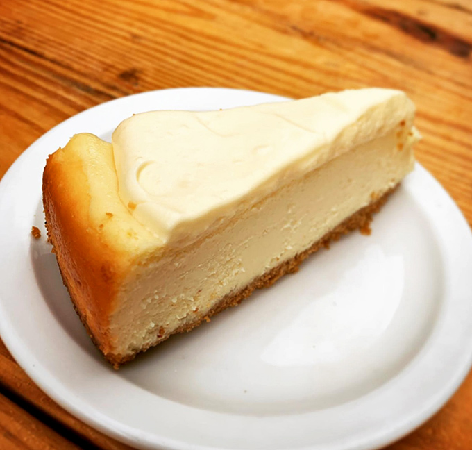 A slice of cheesecake so perfectly executed it deserves its own spotlight and standing ovation. Creamy, dreamy, and utterly swoon-worthy.