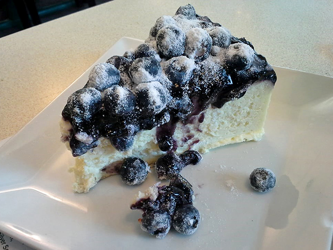 Cheesecake that makes you want to write poetry. This blueberry masterpiece balances sweet and tart like a culinary tightrope walker.