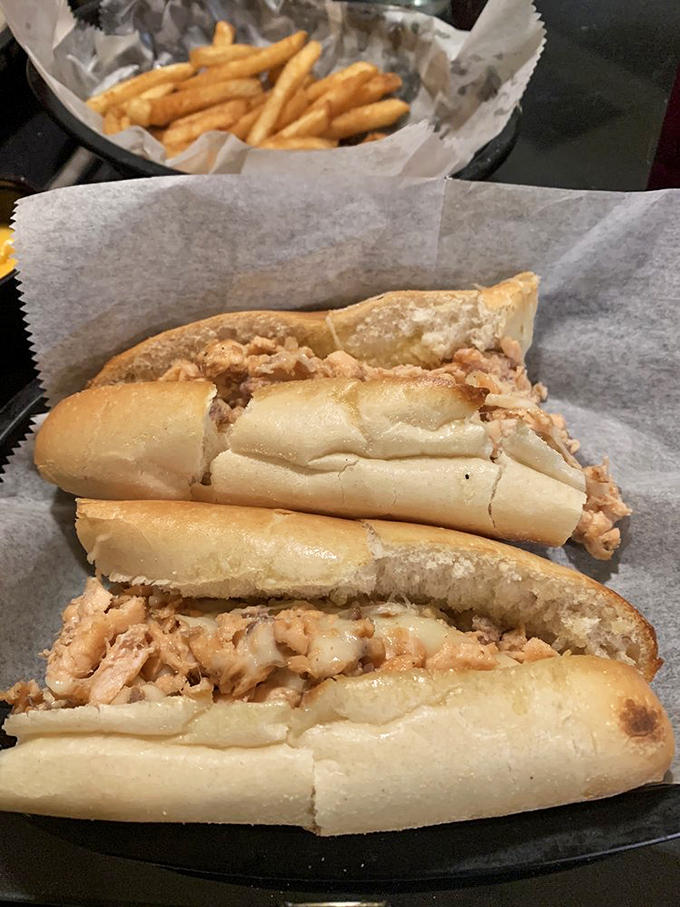 The humble cheesesteak gets the Spanky & Louches treatment – tender meat cradled in a roll that's both sturdy and yielding, with crispy fries standing guard.