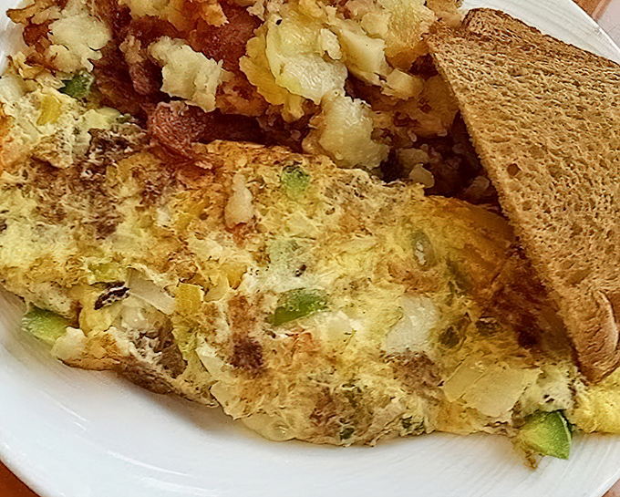The perfect omelet doesn't exi&mdash; Oh wait, here it is! Stuffed with savory fillings and paired with golden home fries, this breakfast doesn't just satisfy&mdash;it conquers.