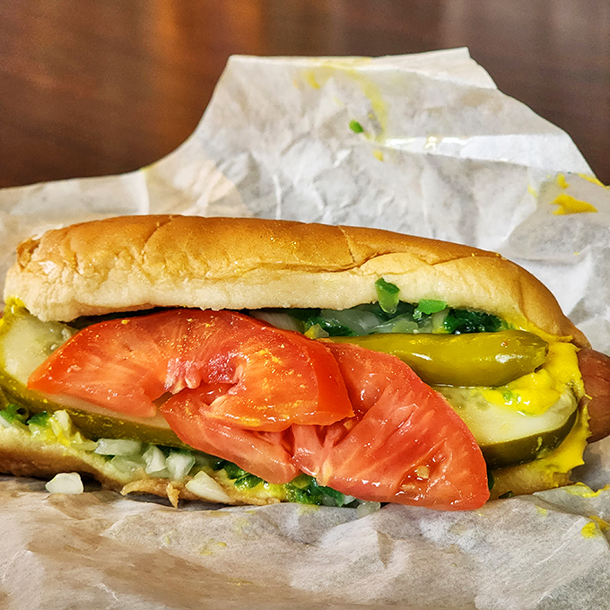 Chicago's hot dog tradition lives on with this beauty&mdash;fresh tomato slices, pickle spears, and mustard creating a symphony of flavors.