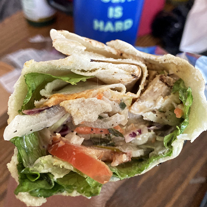 Fresh ingredients transform a simple chicken wrap into something worth crossing town for. That lettuce crunch is the percussion section of your lunch symphony.