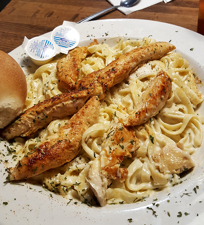 Fettuccine Alfredo with blackened chicken – where Italian comfort meets Cajun kick, proving that cultural fusion is always a good idea when pasta's involved.