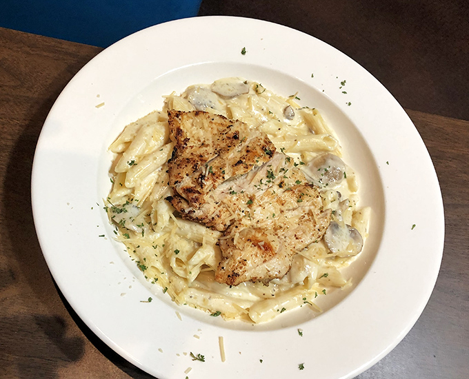 Pasta that doesn't need to show off to impress. That grilled chicken isn't just sitting on those noodles&mdash;it's holding court over a creamy kingdom.