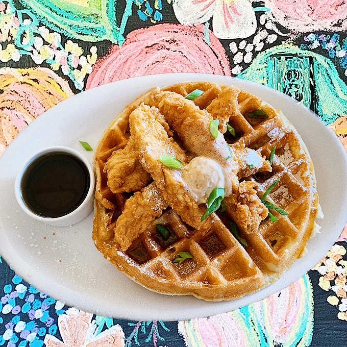 Chicken and waffles: the breakfast equivalent of a perfect marriage. Crispy meets fluffy in a union blessed by maple syrup and green onions.