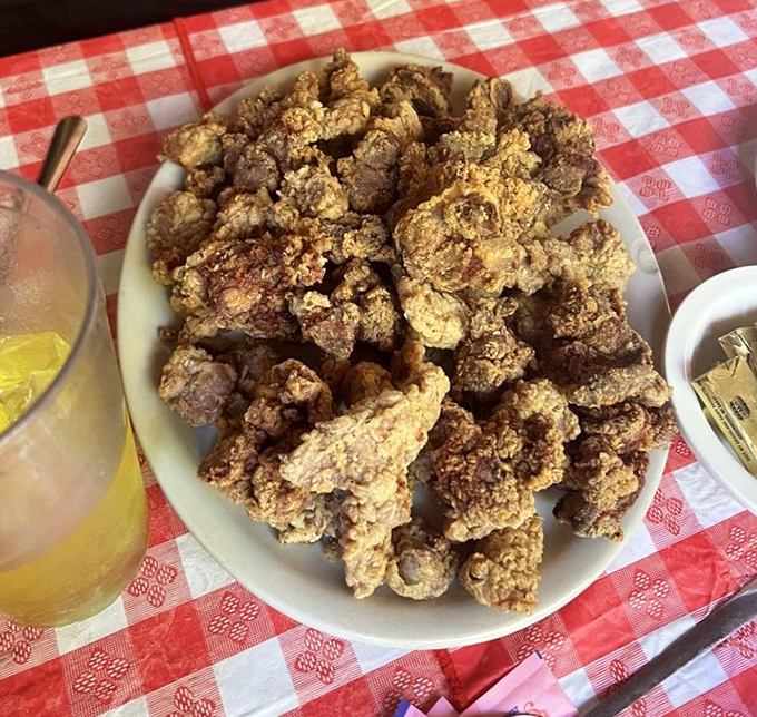 Chicken gizzards transformed from afterthought to delicacy. These crispy morsels convert even the most organ-averse diners into true believers.