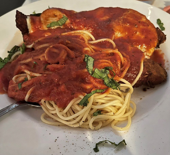 The legendary Chicken Parmesan&mdash;where crispy meets saucy meets cheesy in a trifecta that would make any Italian grandmother weep with joy.