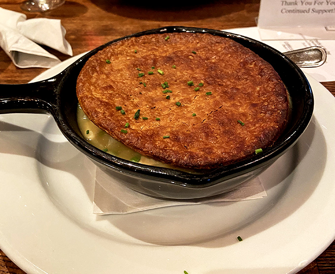 This chicken pot pie isn't just comfort food&mdash;it's a warm hug in a cast iron skillet, complete with that picture-perfect golden crust.