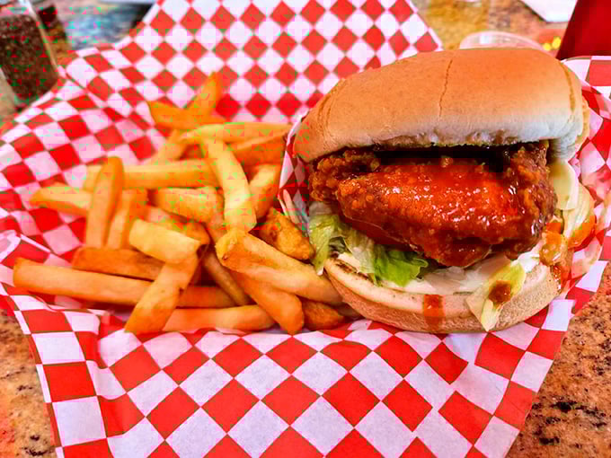 Buffalo chicken sandwich that brings the heat without setting your mouth on fire &ndash; served on a red checkered paper that screams "diner classic."