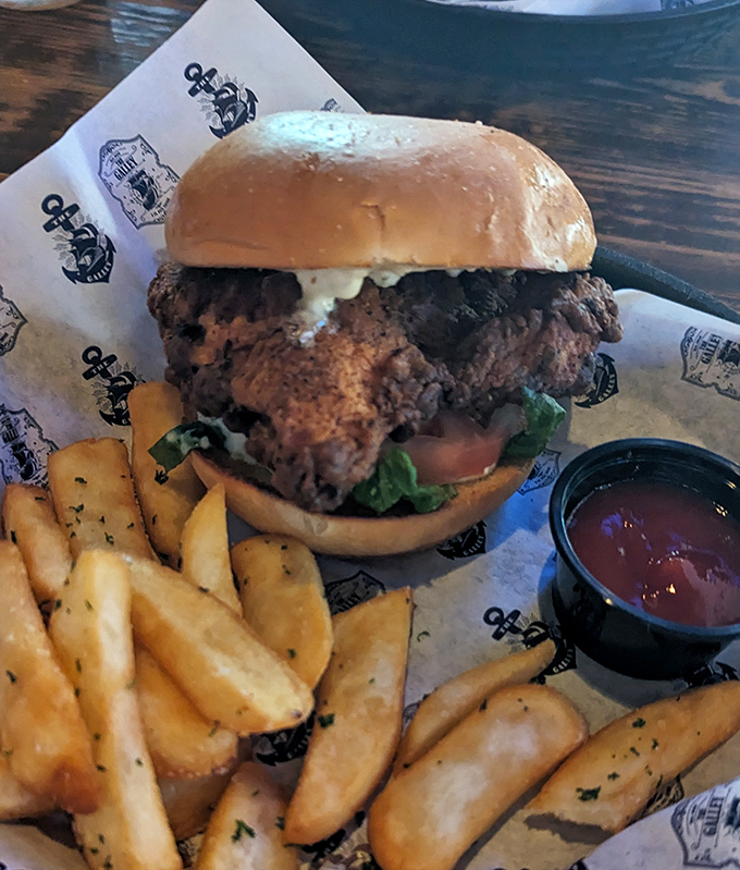 A burger that demands two hands and zero distractions. The fries are just showing off at this point.