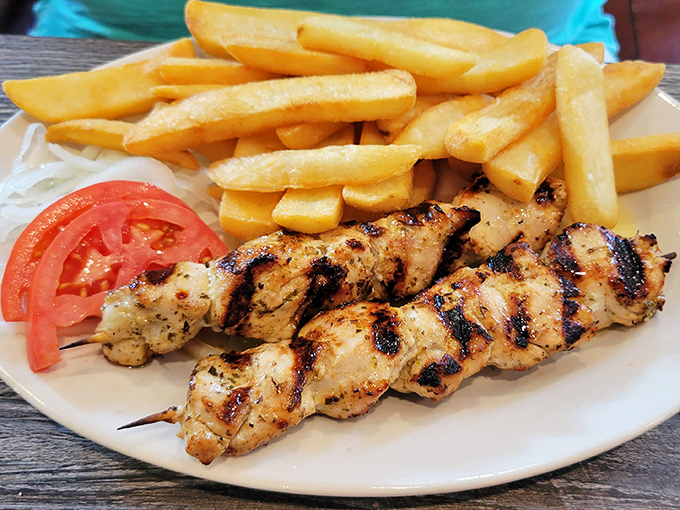 Perfectly grilled chicken souvlaki with crispy fries &ndash; comfort food that would make your Greek grandmother weep with joy.