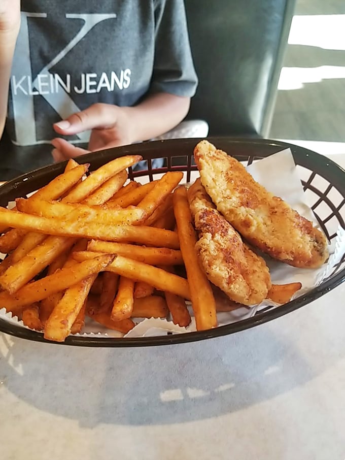 Proof that Juicy Seafood doesn't just excel at ocean fare – these golden chicken tenders and seasoned fries would make Colonel Sanders reconsider his life choices.