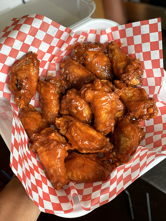 Wings that demand to be noticed. Glistening with sauce and promising that perfect balance of crispy exterior and juicy interior.