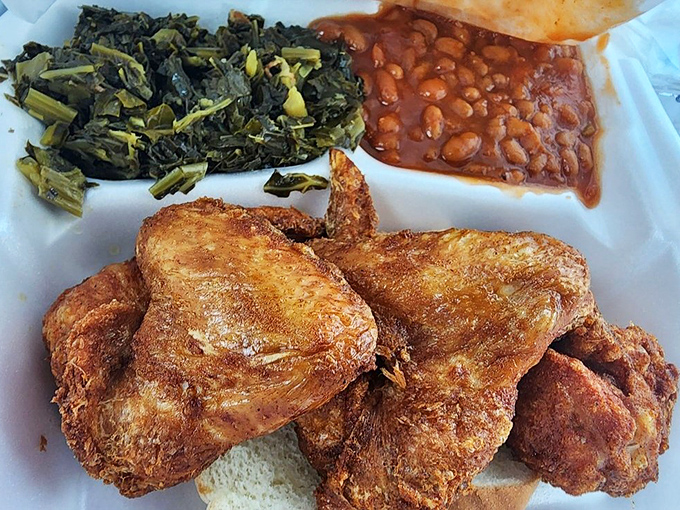 Not just chicken—a religious experience with collard greens and baked beans as worthy disciples. This plate has more soul than a Motown compilation.