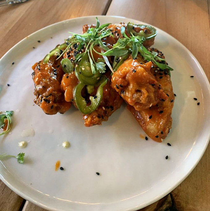 These aren't just wings; they're flavor vehicles decorated with jalape&ntilde;os and sesame seeds that'll make your taste buds stand at attention.