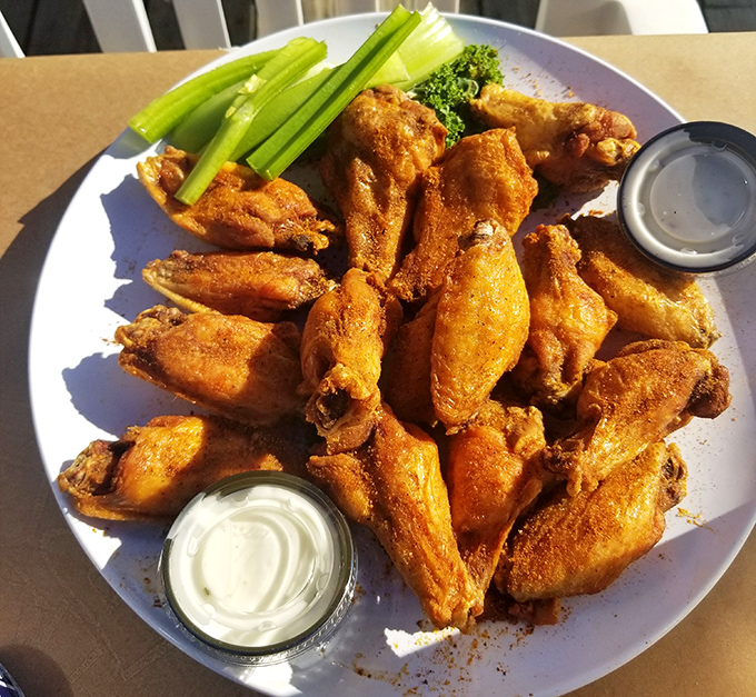 Wings so perfectly crispy, they make you wonder if chickens evolved specifically to be served this way at waterfront bars.