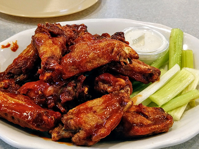 Wings that don't mess around, served with the obligatory celery sticks. The sauce-to-meat ratio here is what mathematicians call "the golden ratio."