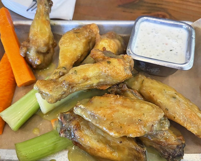These wings aren't just crispy&mdash;they've achieved that mythical texture that makes time stop. The celery is just there as a witness. 