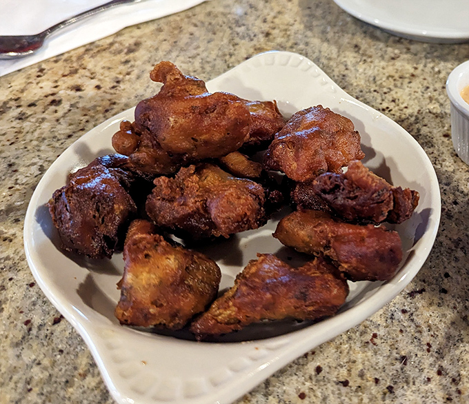 Not everything's artichoke-centric! These crispy chicken wings prove the kitchen knows its way around other ingredients too&mdash;golden, crunchy, and ready for dipping.