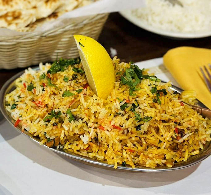 Biryani that plays hide-and-seek with your taste buds—each forkful revealing new treasures of spice, herb, and perfectly cooked rice.