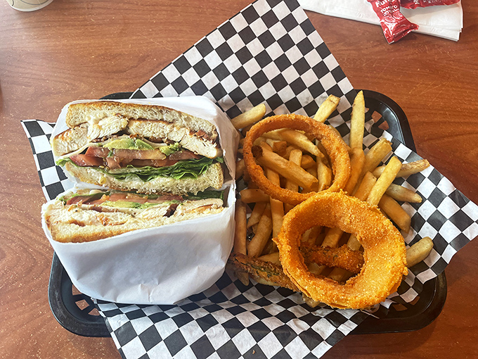 That chicken club isn't just stacked&mdash;it's layered with the precision of a Jenga master who also happens to make incredible sandwiches.