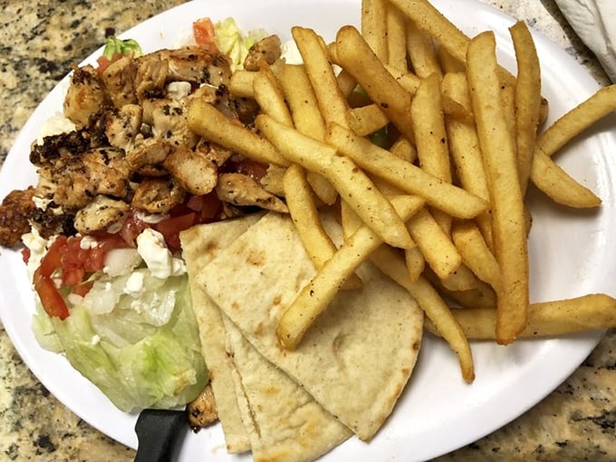 The legendary chicken gyro deconstructed&mdash;seasoned meat, fresh veggies, and warm pita triangles that make you question why you'd eat anything else.