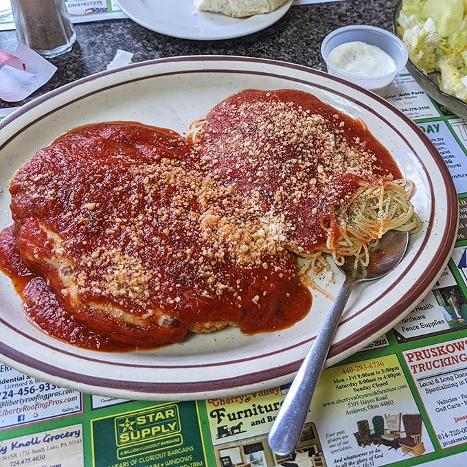 Chicken Parmesan done right – when melted cheese and marinara achieve perfect harmony.