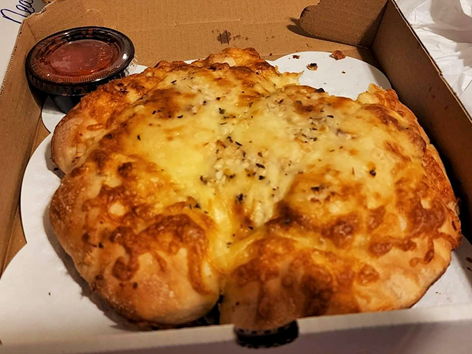 Golden, bubbling cheese casts a sunset-like glow over this chicken pot pie, a comfort food classic worth crossing state lines for.