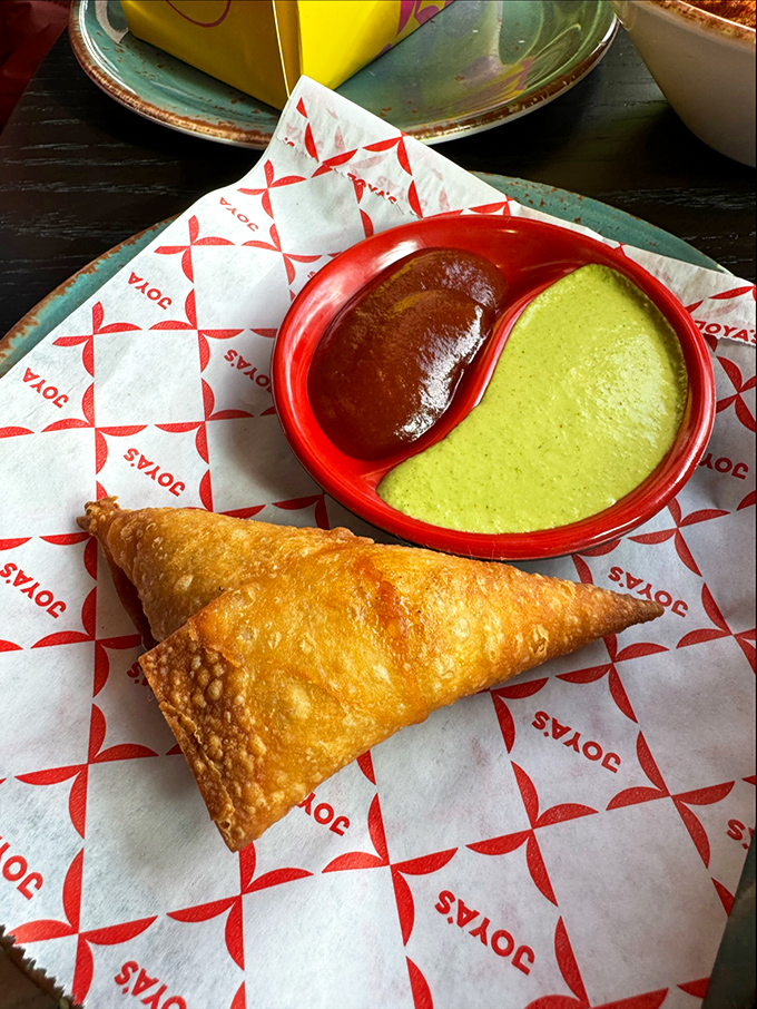 The humble samosa, transformed into a golden triangle of possibility, with dipping sauces playing good cop/bad cop with your taste buds.