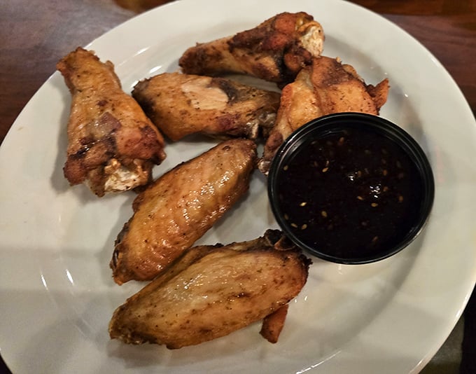 Wings that justify their own pilgrimage. Crispy, golden-brown perfection with sauce that strikes that magical balance between tangy heat and buttery bliss.