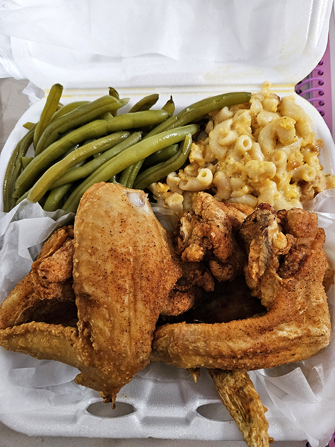 Fried chicken, green beans, and mac & cheese—the holy trinity of comfort. This isn't just a meal; it's what happiness would look like if it came in a to-go container.