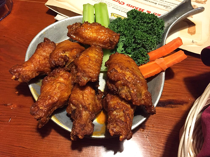 These aren't just wings—they're the reason napkins were invented. Crispy, saucy, and served with veggies that politely pretend you might eat them first.
