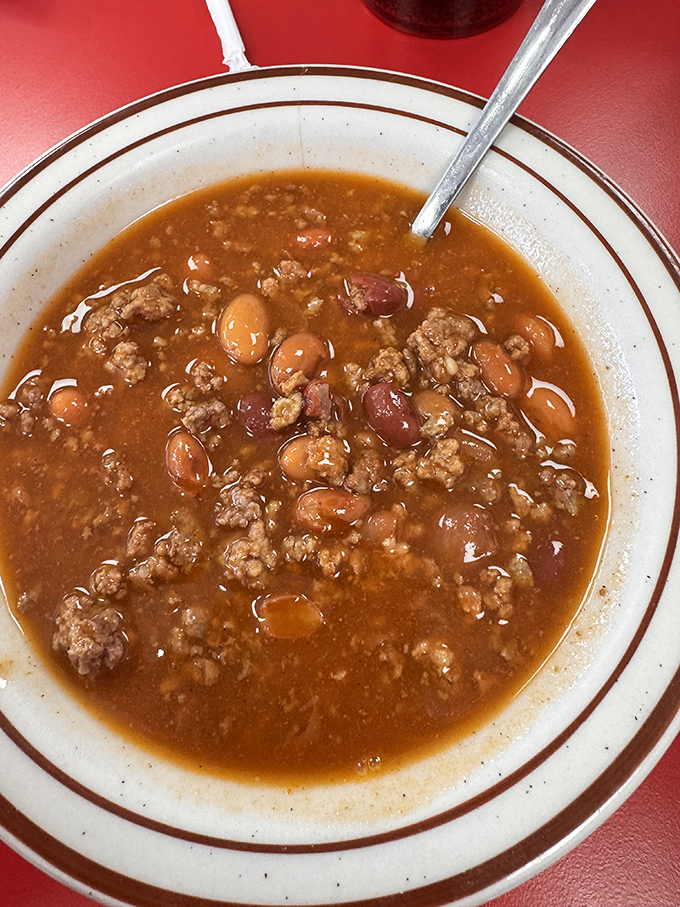 The chili &ndash; hearty, bean-studded, and meaty &ndash; isn't just a side dish; it's a warm hug in a bowl that's been comforting Fort Wayne residents through Indiana winters for generations.