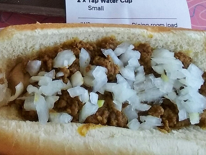 This chili dog, topped with a snowfall of diced onions, is the kind of straightforward deliciousness that makes you question why anyone would complicate food.