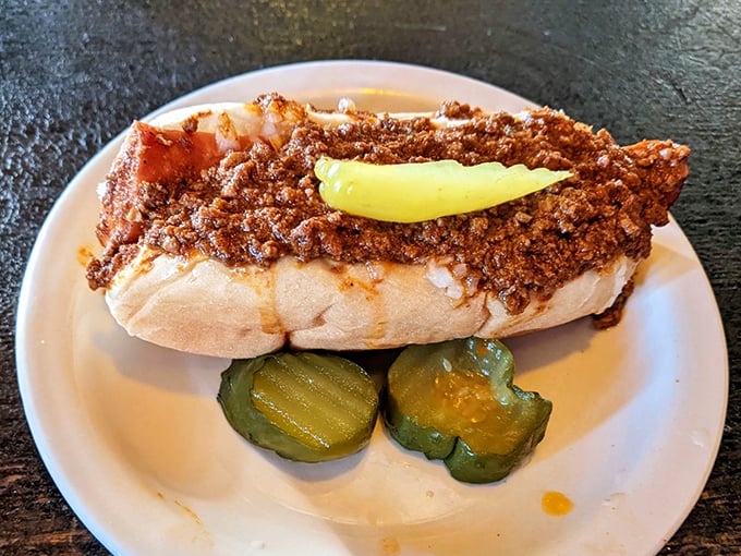 This chili-covered masterpiece is what happens when comfort food goes to finishing school and graduates with honors.