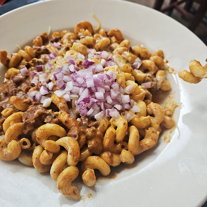 Comfort food that hugs your soul. This hearty mac topped with diced onions isn't just dinner&mdash;it's therapy in a bowl.